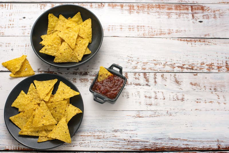 Nachos Corn Chips with Fresh Homemade Salsa on Light Wooden Table. Top ...