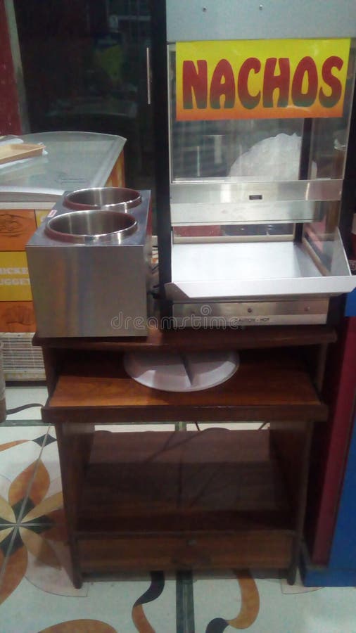 Nachos making machine stock photo. Image of machine - 244473288