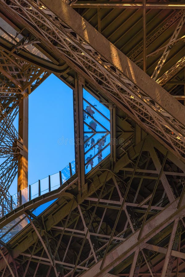 Nadir Shot from Below with People Walking on a Glass Floor on the First ...