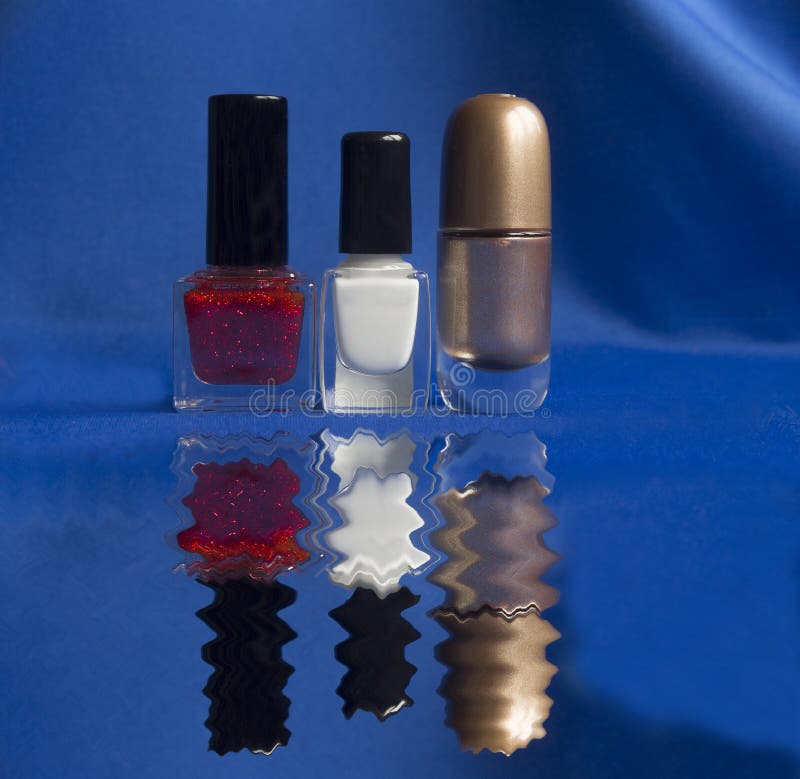 Nail polish in 3 colours stock image. Image of style - 201992309