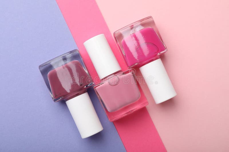 Nail Polishes in Bottles on Color Background, Flat Lay Stock Photo ...