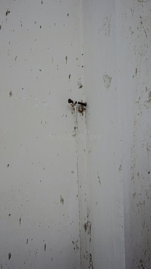 A Nail Stuck in a Building Wall. Stock Photo - Image of nail, line ... A Nail Stuck in a Building Wall. Stock Photo - Image of nail, line ...