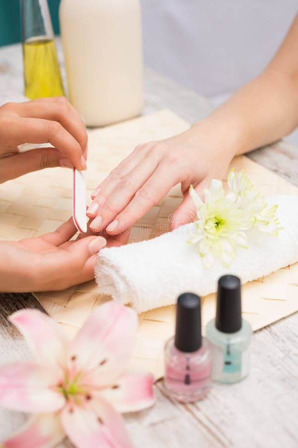 Nail Technician Giving Customer a Manicure Stock Image - Image of front ...