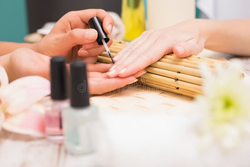 Nail Technician Giving Customer a Manicure Stock Image - Image of table ...