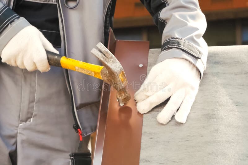 Nailing and Hammering Sheet of Roofing Iron Stock Photo - Image of ...