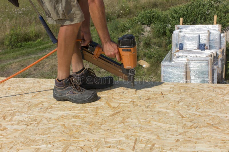 Nailing nails into the MDF stock image. Image of sticking - 98215171