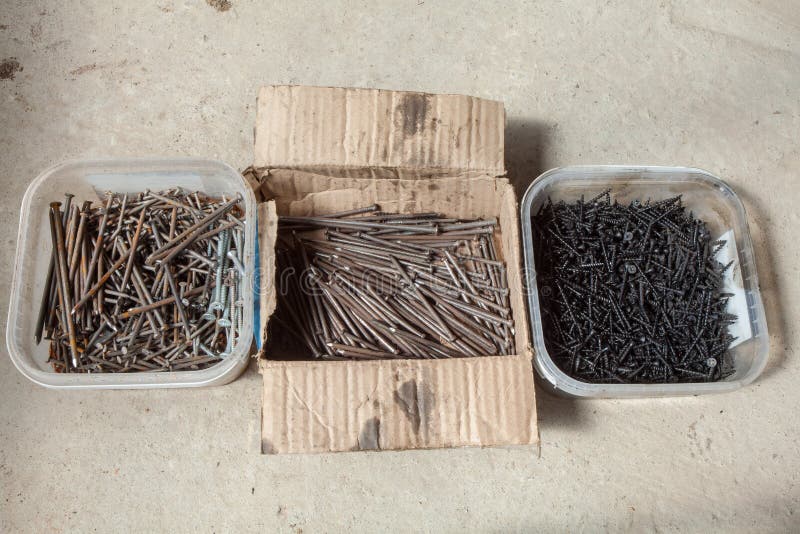 Nails and Screws are in the Plastic and Paper Boxes. Stock Image ...