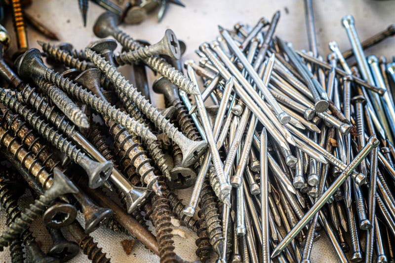 Nails Srews and on a Dropsheet Stock Image - Image of touched, plumbing ...