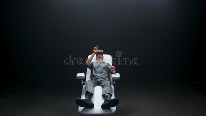 Nano Technologies Gamer Immersed VR Dark Room. Man Enjoying Haptic ...