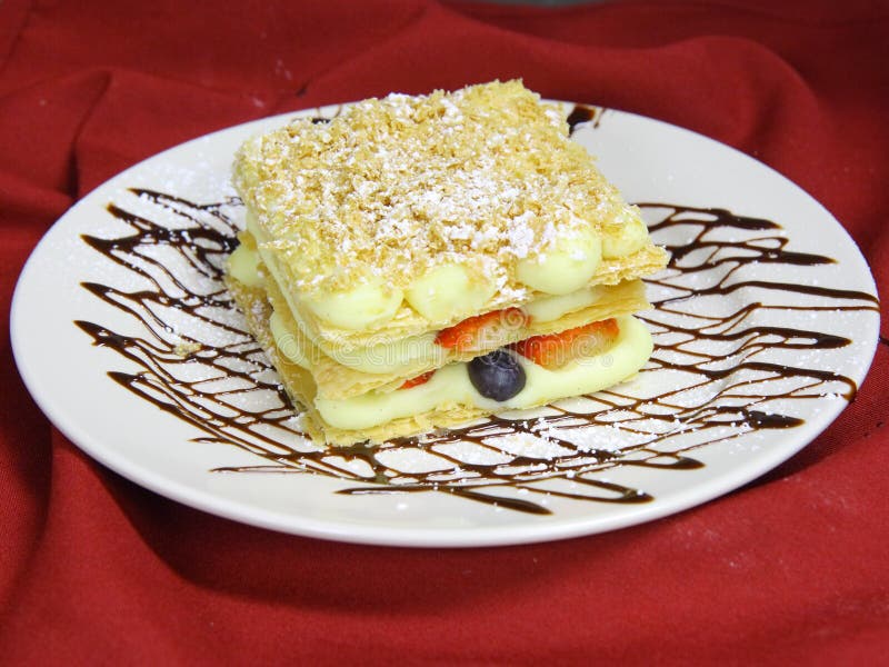 Napoleon cake on the plate stock image. Image of bakery - 4056683