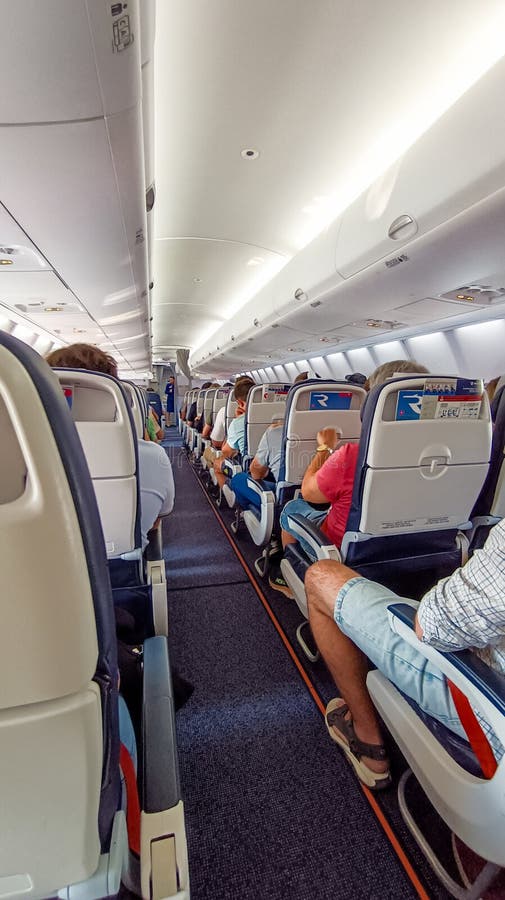 Narrow Aisle between Seats in the Airplane Cabin Editorial Image ...