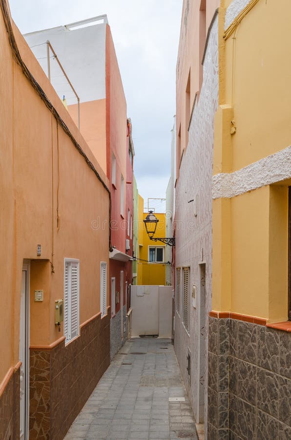 A Narrow Alley without People with Coloured Facades Stock Photo - Image ...