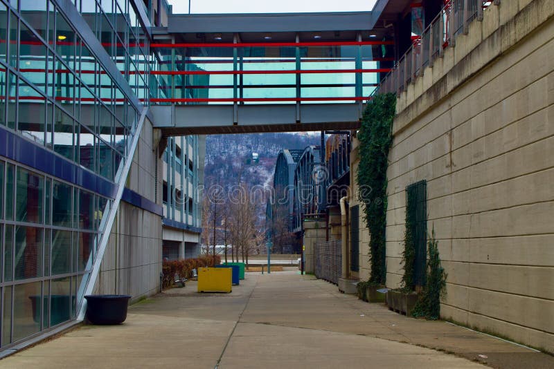 Narrow Alley Under a Modern Glass Bridge during Daytime Stock Image ...