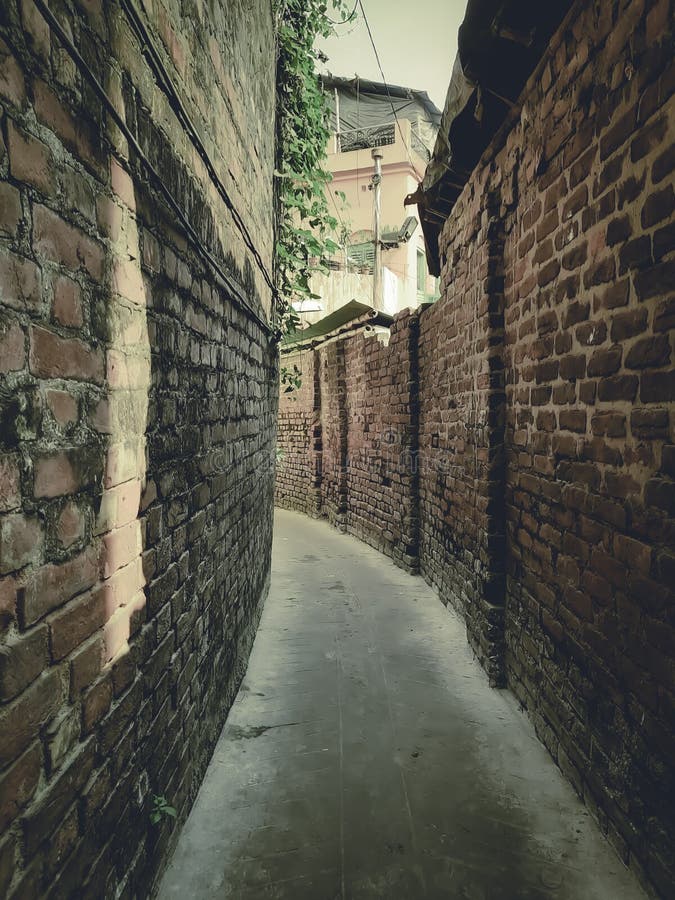 A Narrow Alley, Wall of Red Bricks on Both Sides. Stock Photo - Image ...