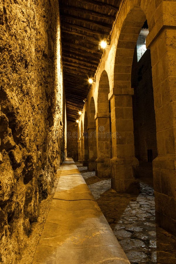 Narrow arches at night stock image. Image of lights, town - 84216851