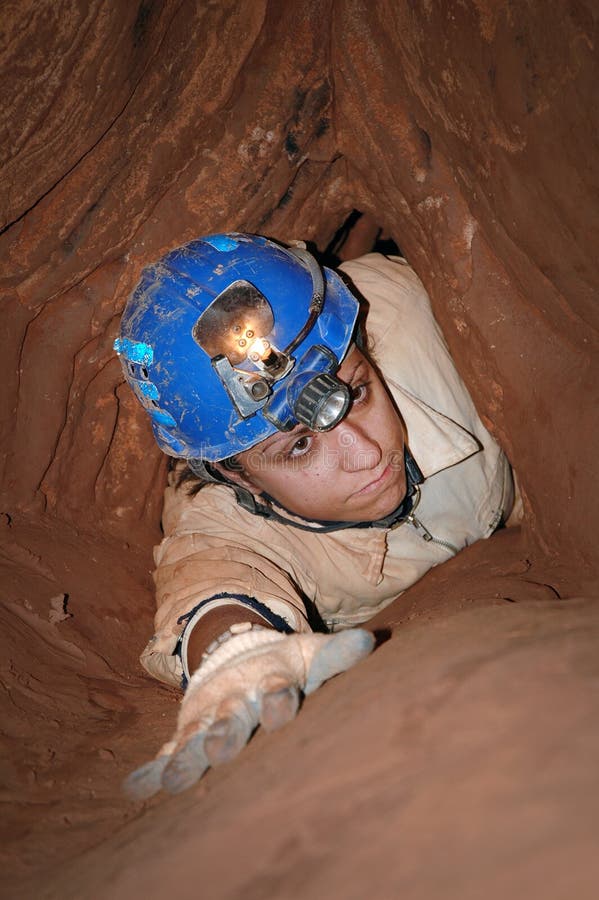 Narrow Cave Passage with a Cave Explorer Stock Image - Image of cave ...