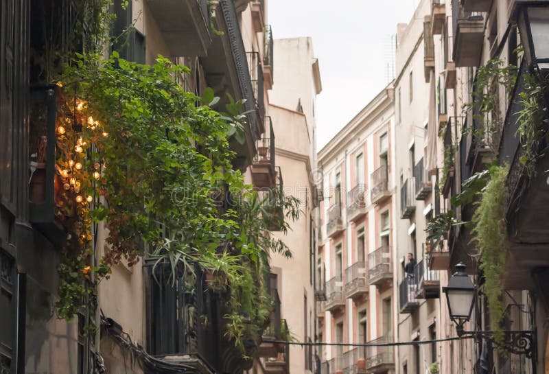A Narrow European Street with Lights at Sunset Stock Image - Image of ...