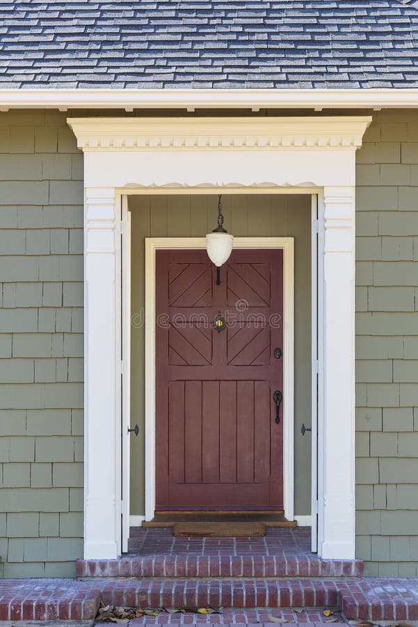 Narrow front door, brown stock photo. Image of handle - 66539912