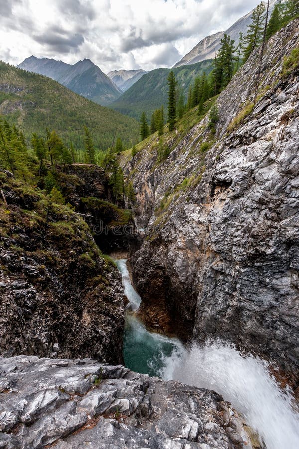 Narrow Gorge with a Small River and a Waterfall. Stock Image - Image of ...