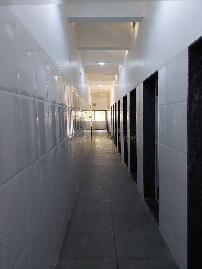 Narrow Long White Corridor and Passage with Many Small Rooms on the ...