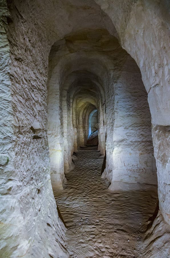 Narrow Cave Passage With Caver Stock Image - Image of cavern ...