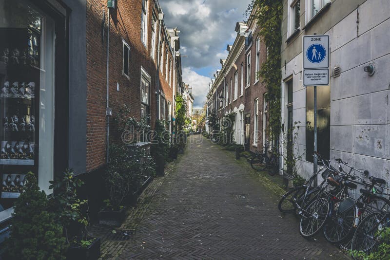 Narrow Path through the Brick Buildings and Bicycles Editorial ...