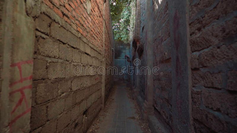 Narrow Path between Brick Walls, Moving Camera Forward Stock Footage ...