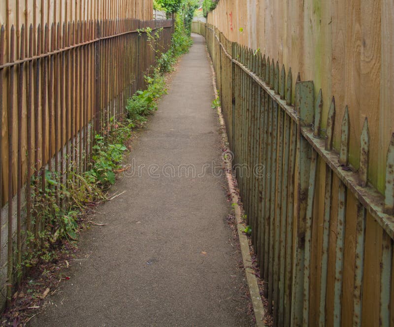 Narrow Path between Fences stock image. Image of alley - 44851577