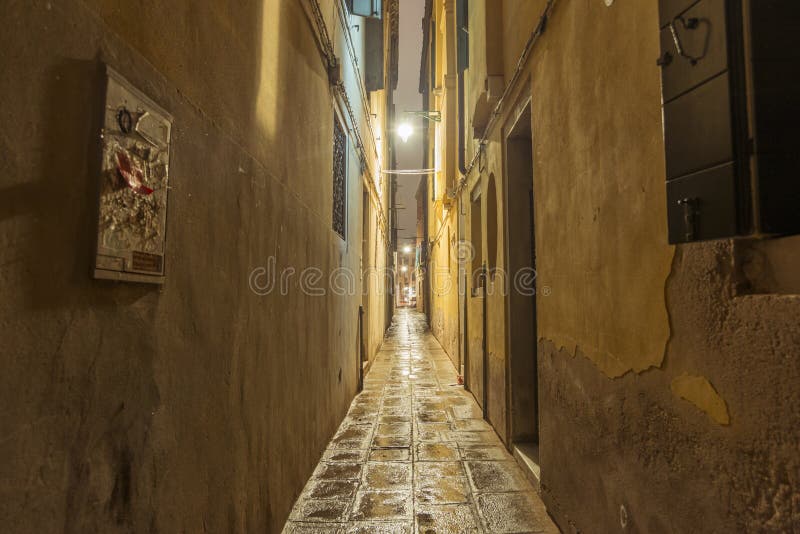 Narrow path in Venice stock photo. Image of pavement - 108048058