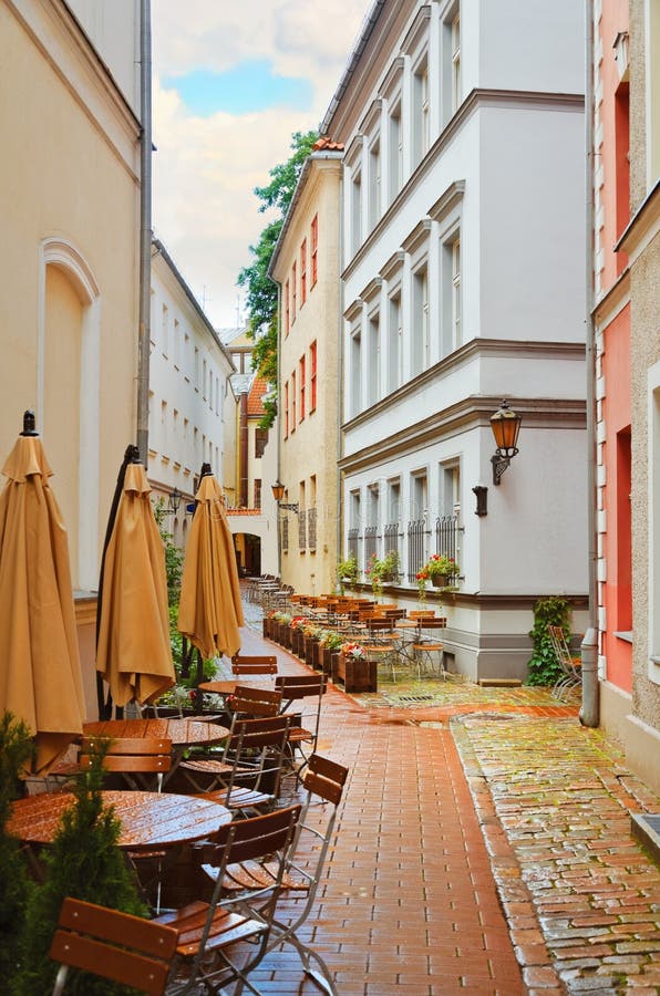 Narrow Riga street stock image. Image of cafeteria, exterior - 26206245