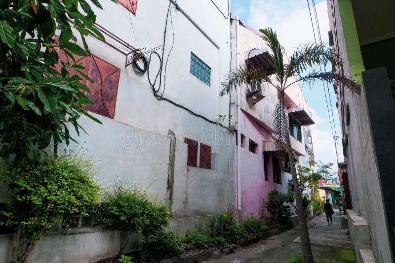 Narrow Road Flanked by High Rise Buildings Stock Photo - Image of ...