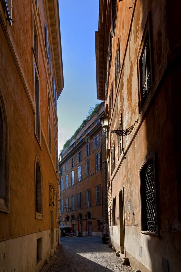 Narrow roman street stock image. Image of monument, italian - 26482829