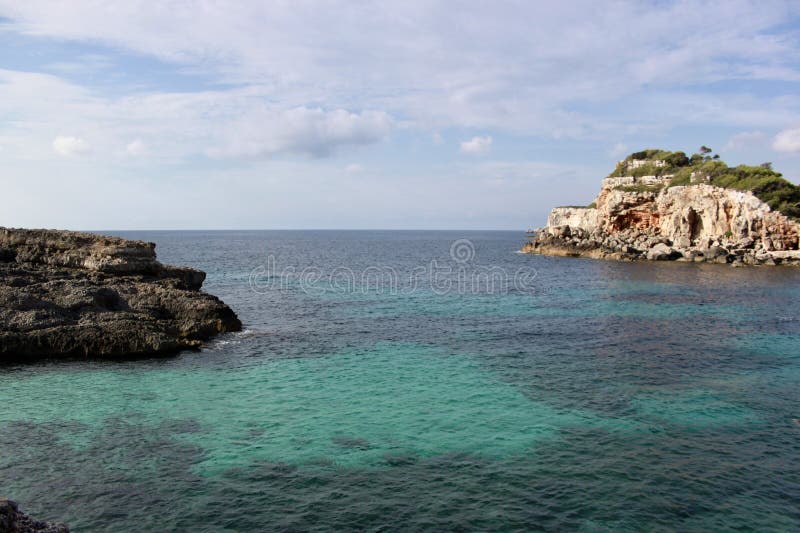 A Narrow Strait among the Sharp Rocks on the Island of Mallorca. Stock ...