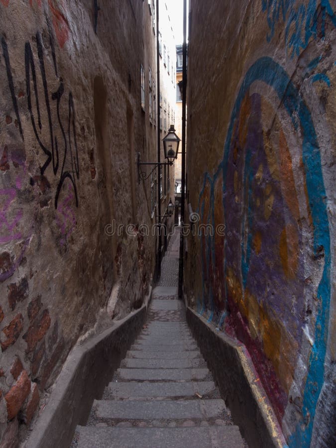 Narrow Street with Graffitis Stock Photo - Image of landscape ...
