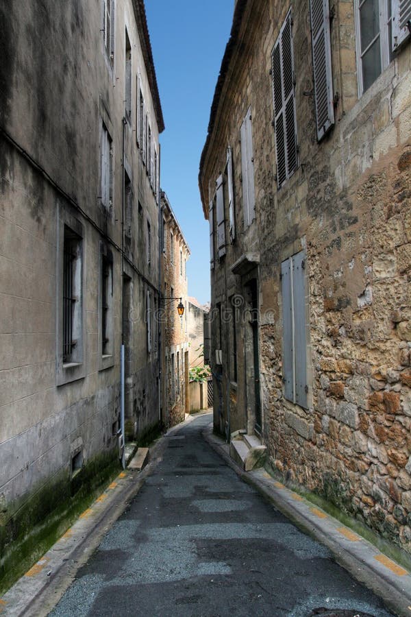 Narrow street in old city stock image. Image of doors - 14437059
