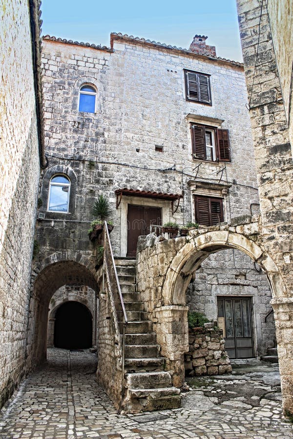 Narrow Street with Stone Arch Stock Photo - Image of gate, green: 49647820