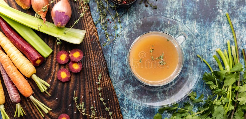 Narrow Top Down View of a Tea Cup of Broth with a Cutting Board of ...