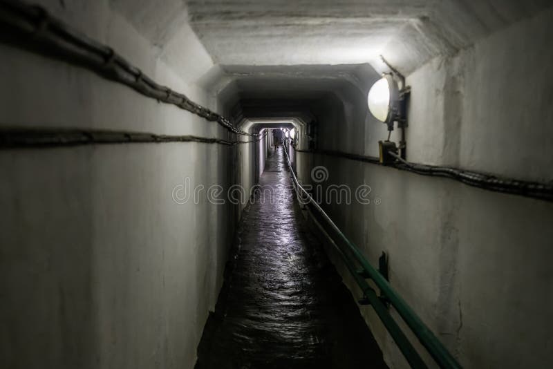 Narrow Underground Corridor Connecting Surface Facilities To the ...