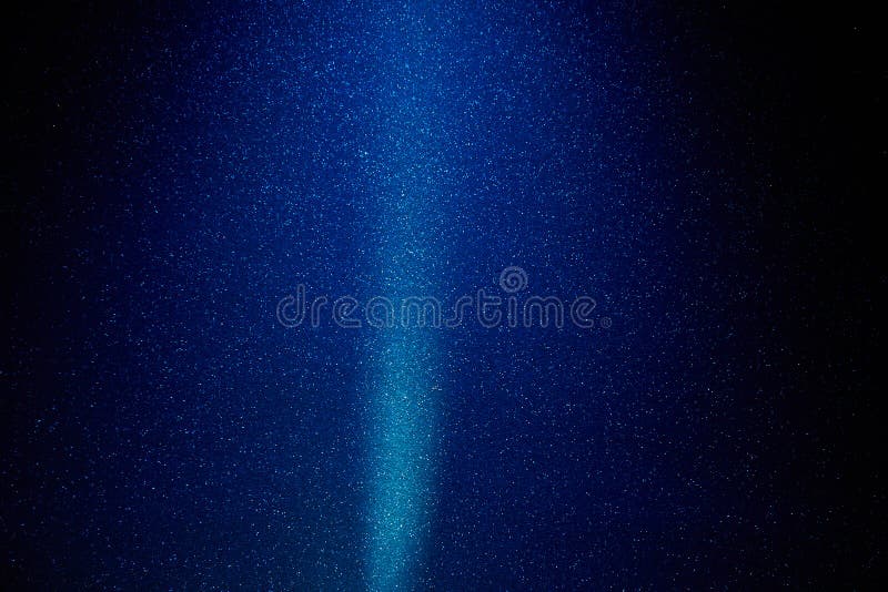 Narrow Vertical Light Blue Beam of Light on a Blue Gradient Background ...