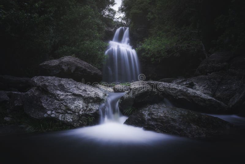 Narrow Waterfall in a Cliff Face in New Zealand Stock Photo - Image of ...