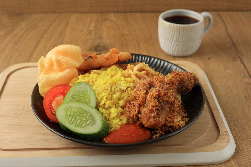 Nasi Kuning Ayam Goreng stock photo. Image of rice, milk - 306859852
