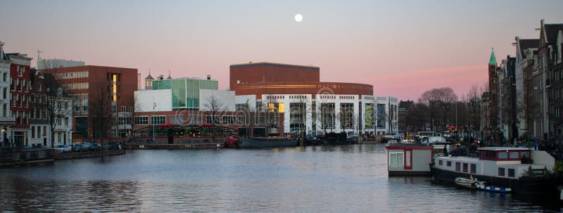 National Opera Museum in Amsterdam with Full Moon and Amstel River in ...