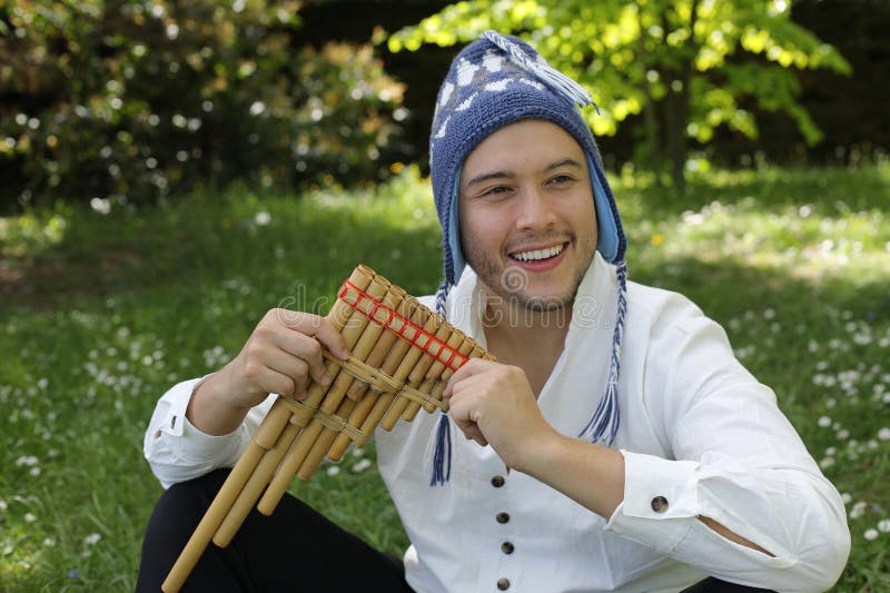 Native American Man Playing a Wooden Flute Stock Photo - Image of ...