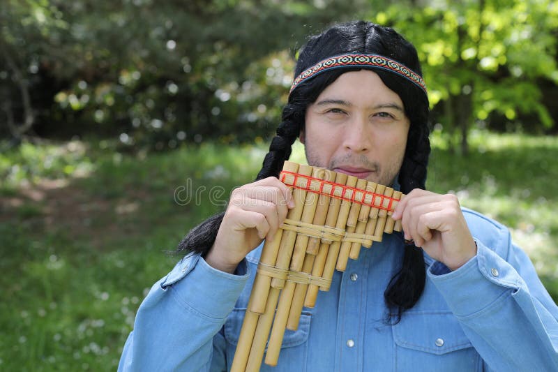 Native American Man Playing a Wooden Flute Stock Image - Image of ...