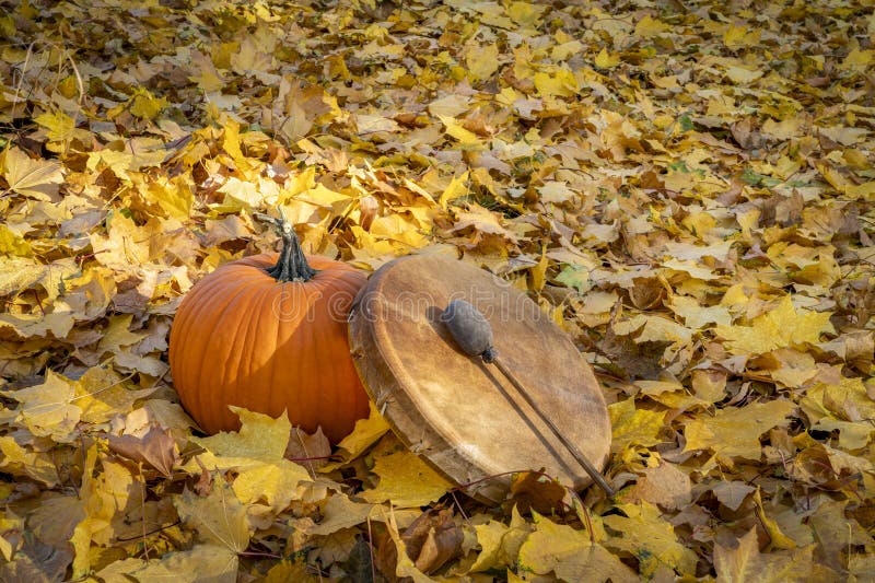 Native American Style Drum with Pumpkin on a Backyard Lawn Covered by ...