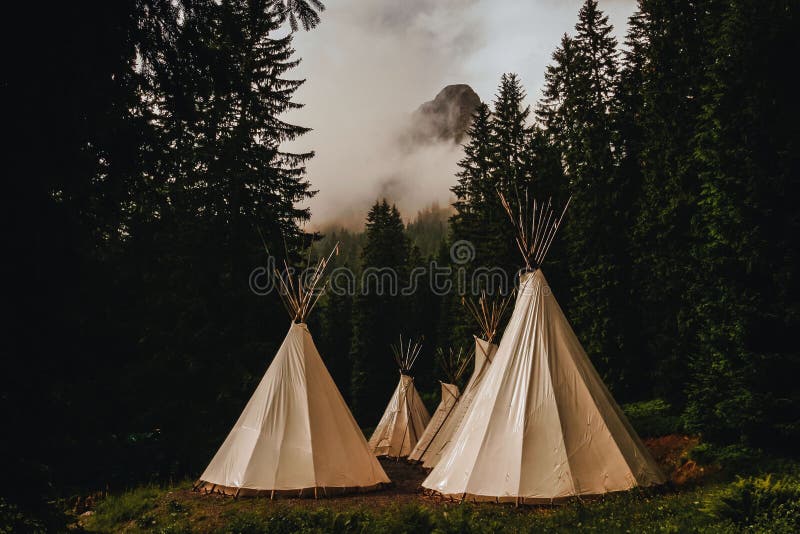 Native American Teepees after a Rain in the Middle of a Forest in the ...