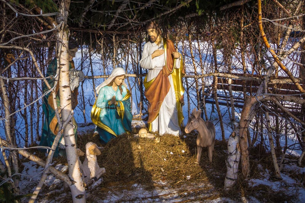 A Nativity Scene Depicts Mary, Joseph, and Animals in a Rustic Stable ...