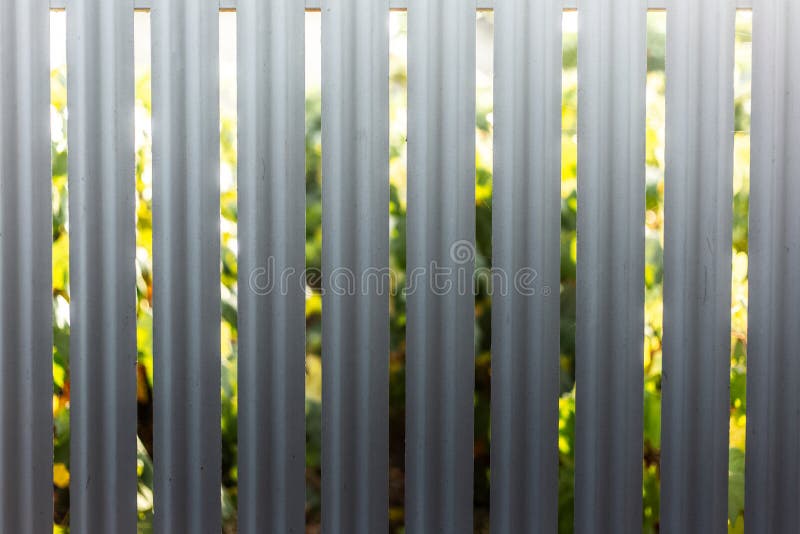 Natural Abstract Background of Metal Fence in Shape of Lines. Stock ...