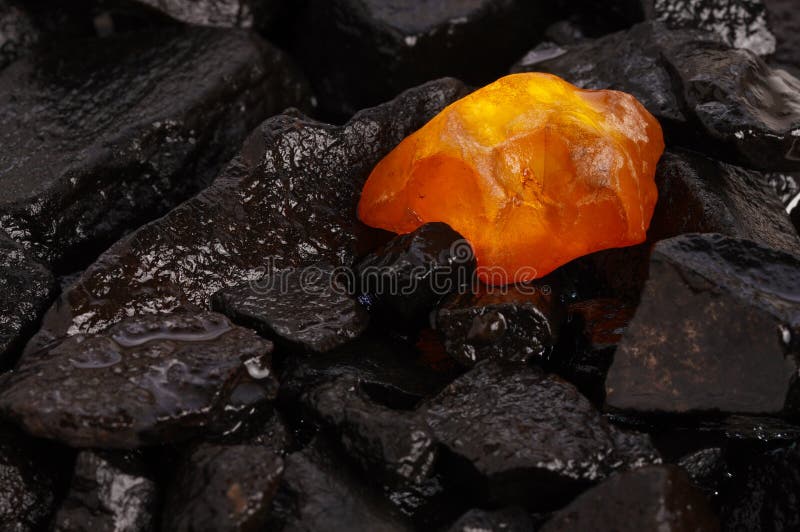 Natural Amber. a Piece of Yellow and Red Translucent Natural Amber on a ...