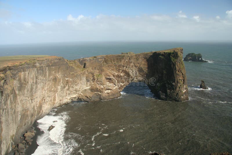 Natural Arch in the Coast Rocks South Iceland Stock Photo - Image of ...